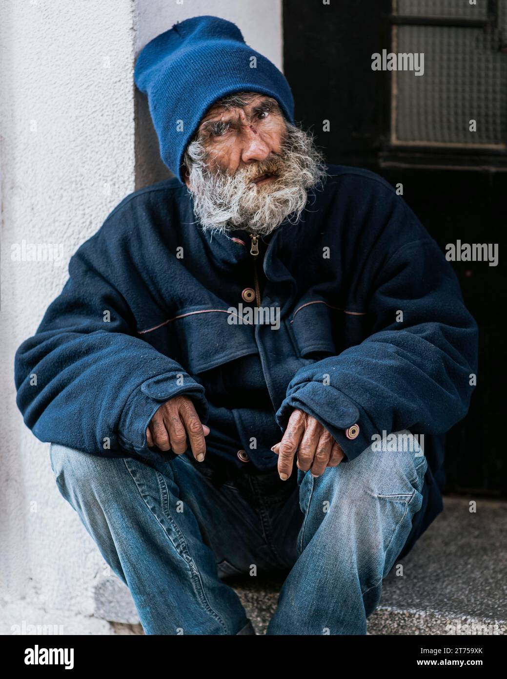 Front view homeless man with beard doorstep Stock Photo - Alamy