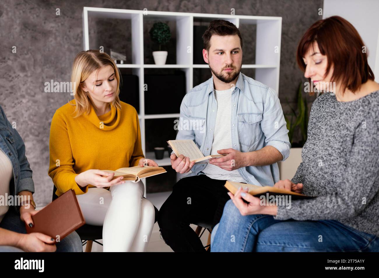 Group people reading books therapy session Stock Photo - Alamy