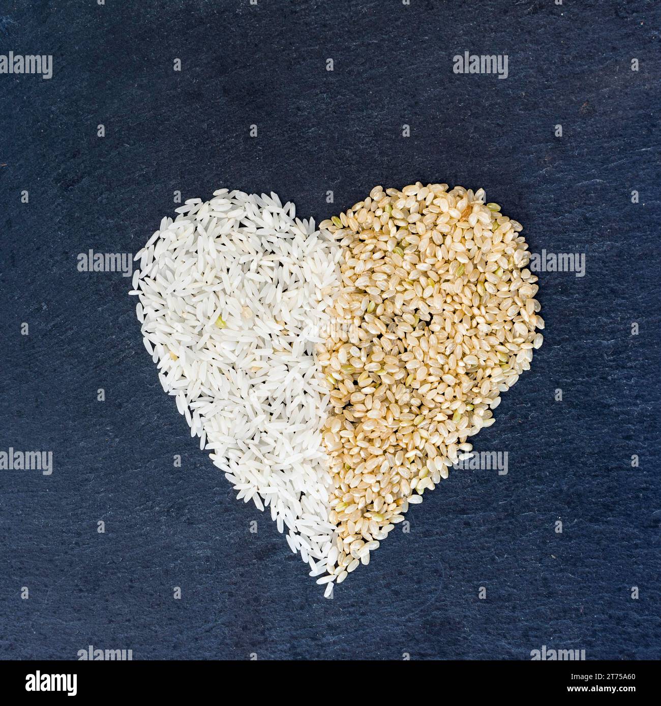 Heart shape from rice grains table Stock Photo - Alamy