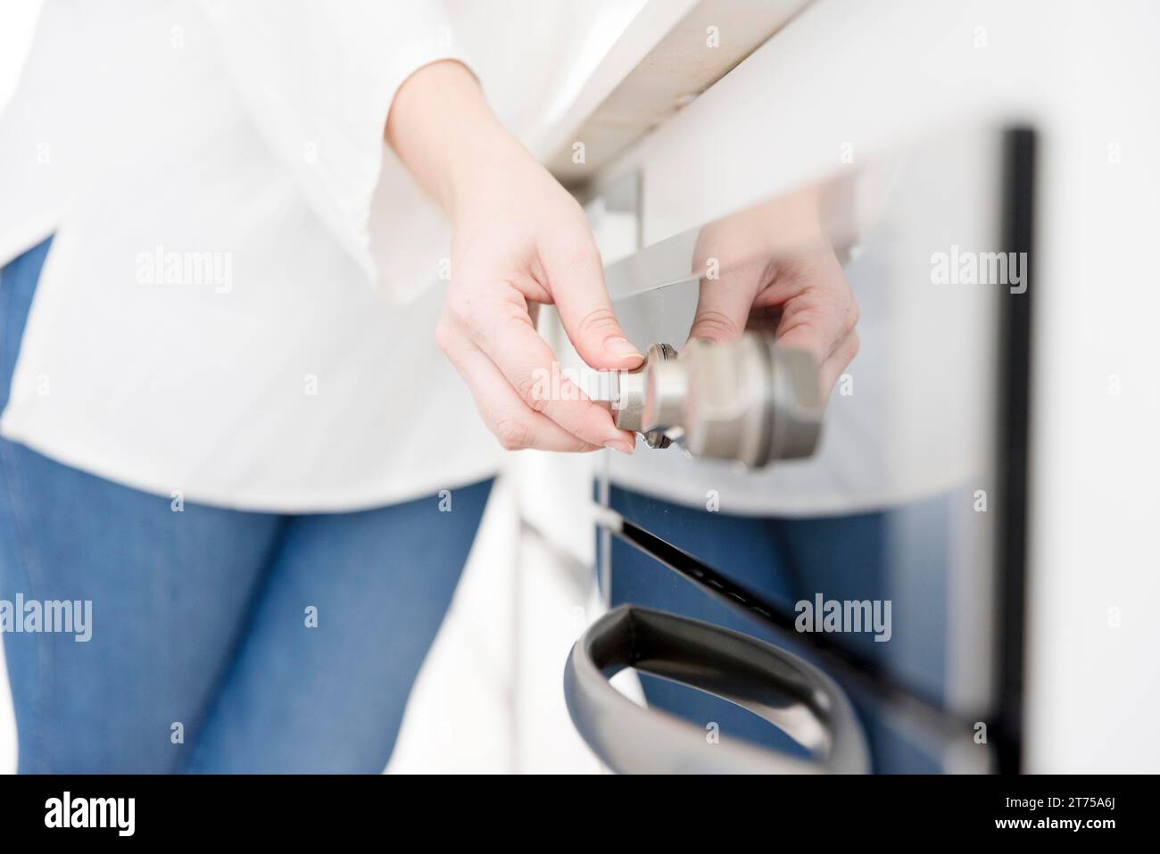 Hand turning oven Stock Photo - Alamy