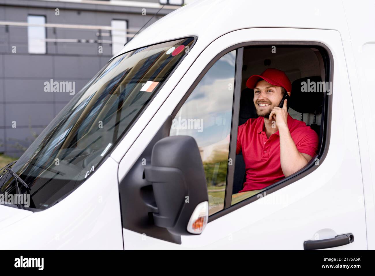 High angle delivery service man talking phone Stock Photo - Alamy