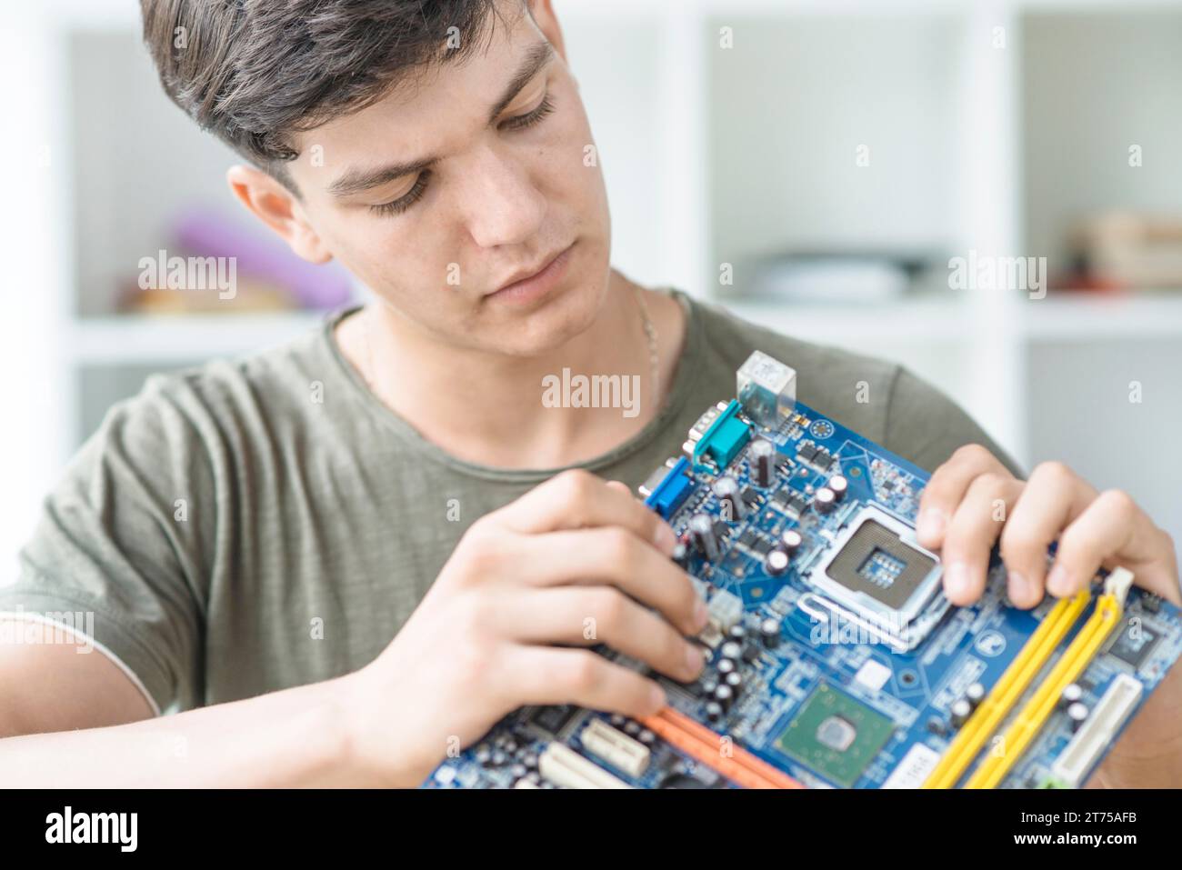 Male it technician repairing motherboard Stock Photo - Alamy