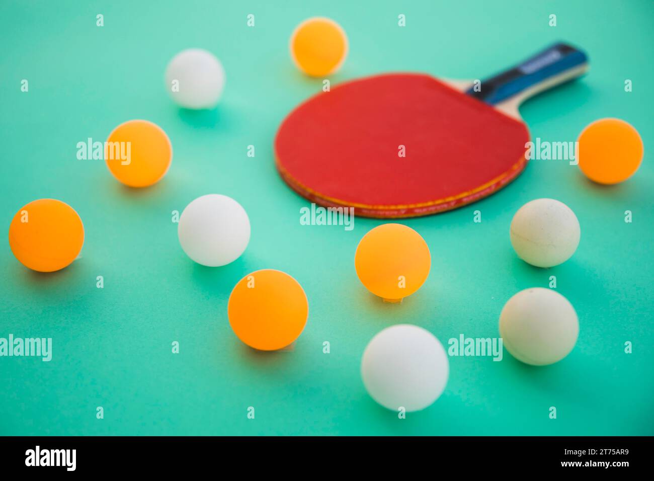 Ping pong balls wooden racket turquoise background Stock Photo - Alamy