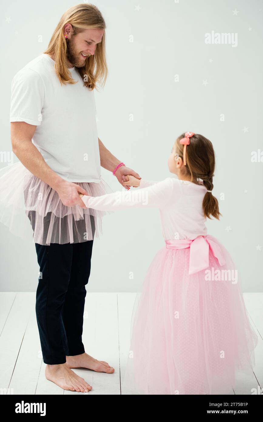 Side view father daughter tutu skirts Stock Photo - Alamy