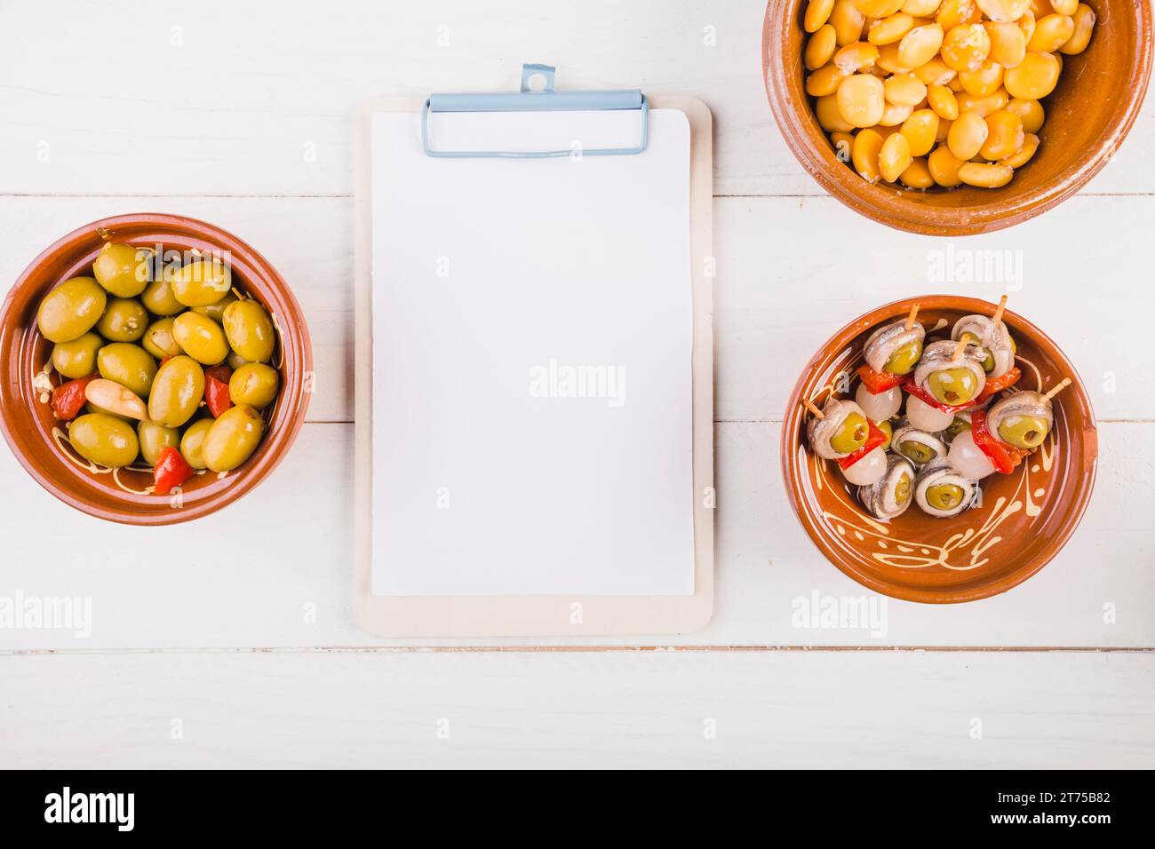 Snack plates with clipboard desktop Stock Photo - Alamy