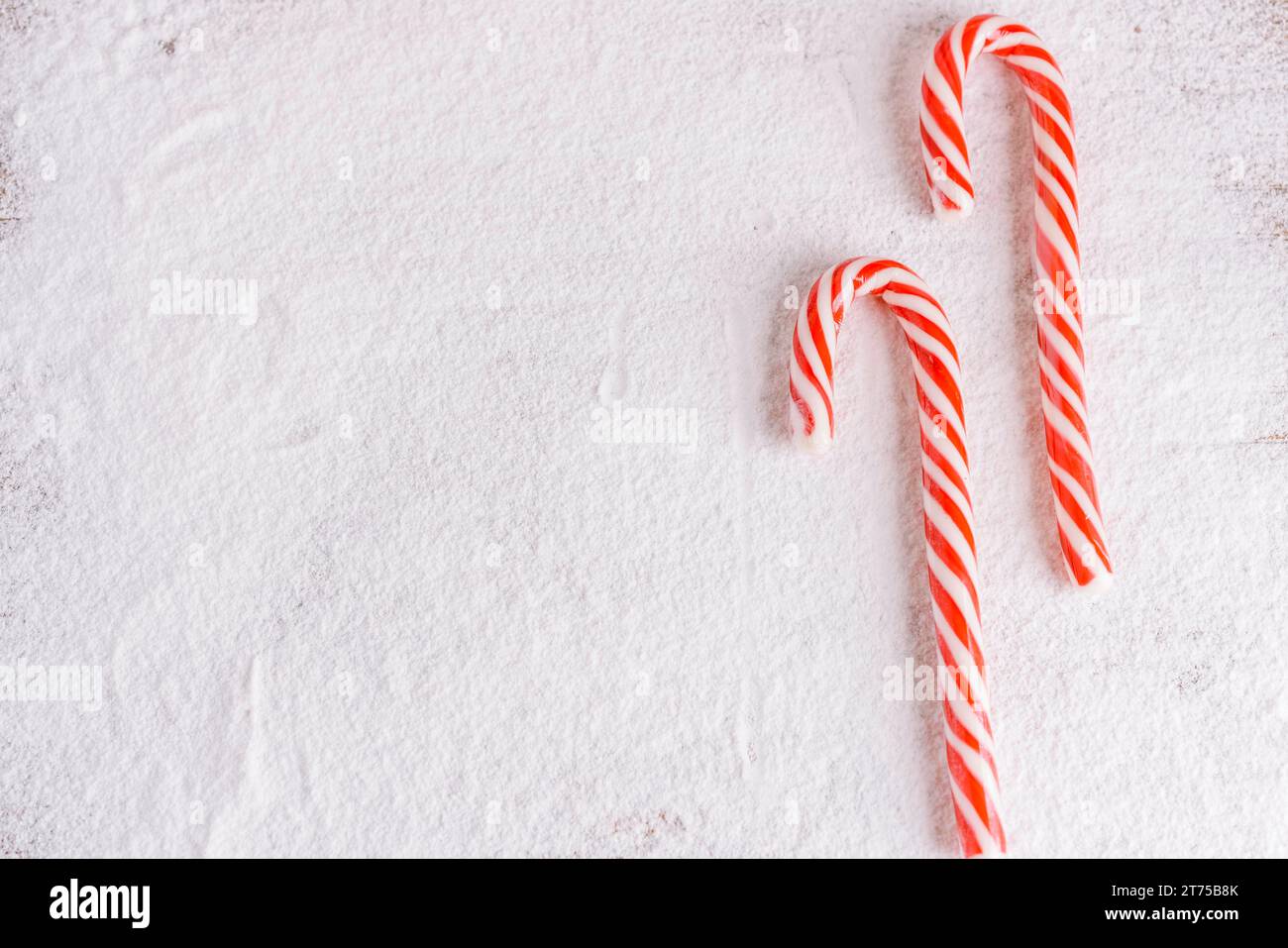 Striped candy canes powdered sugar Stock Photo - Alamy