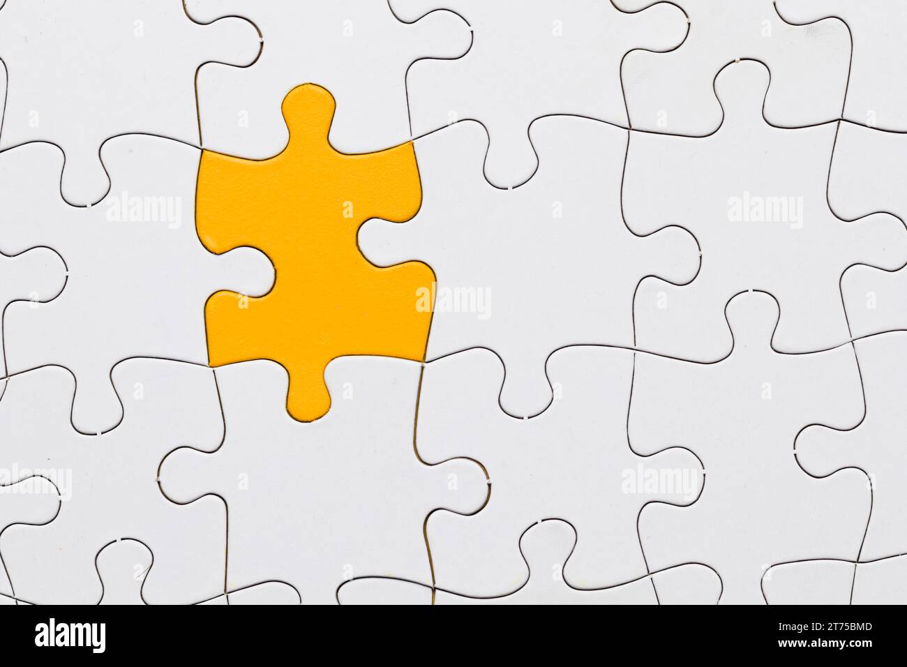 White jigsaw puzzle sheet with yellow puzzle piece center Stock Photo ...