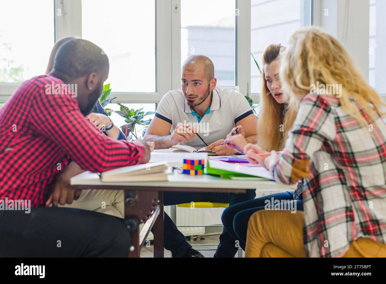 Young students working project together Stock Photo - Alamy