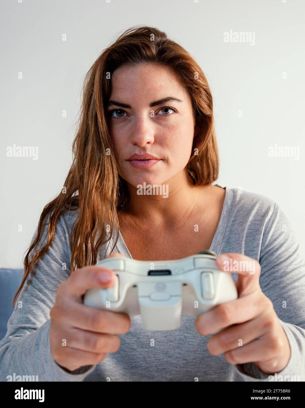 Woman playing joystick Stock Photo - Alamy