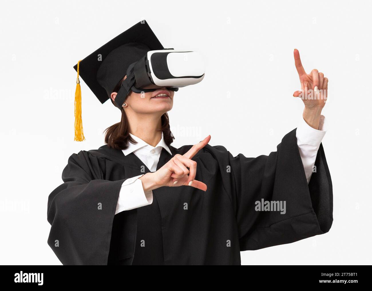 Woman with graduation robe cap wearing virtual reality headset 3 Stock ...