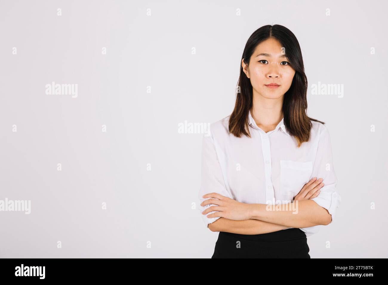Hispanic woman crossed arms hi-res stock photography and images - Alamy