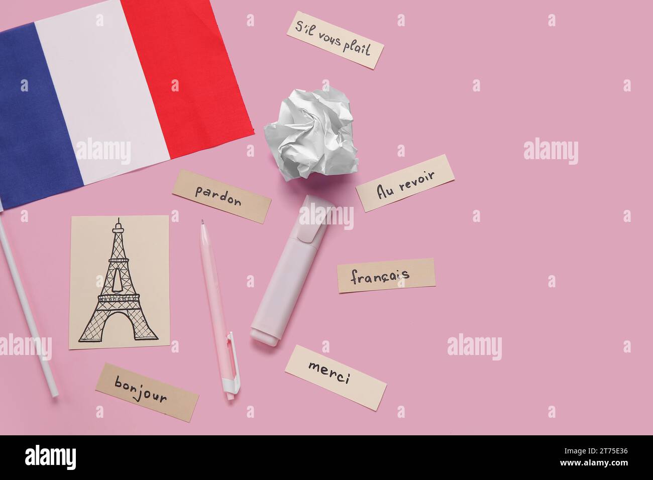 Flag of France with French words, drawn Eiffel Tower, pens and crumpled ...