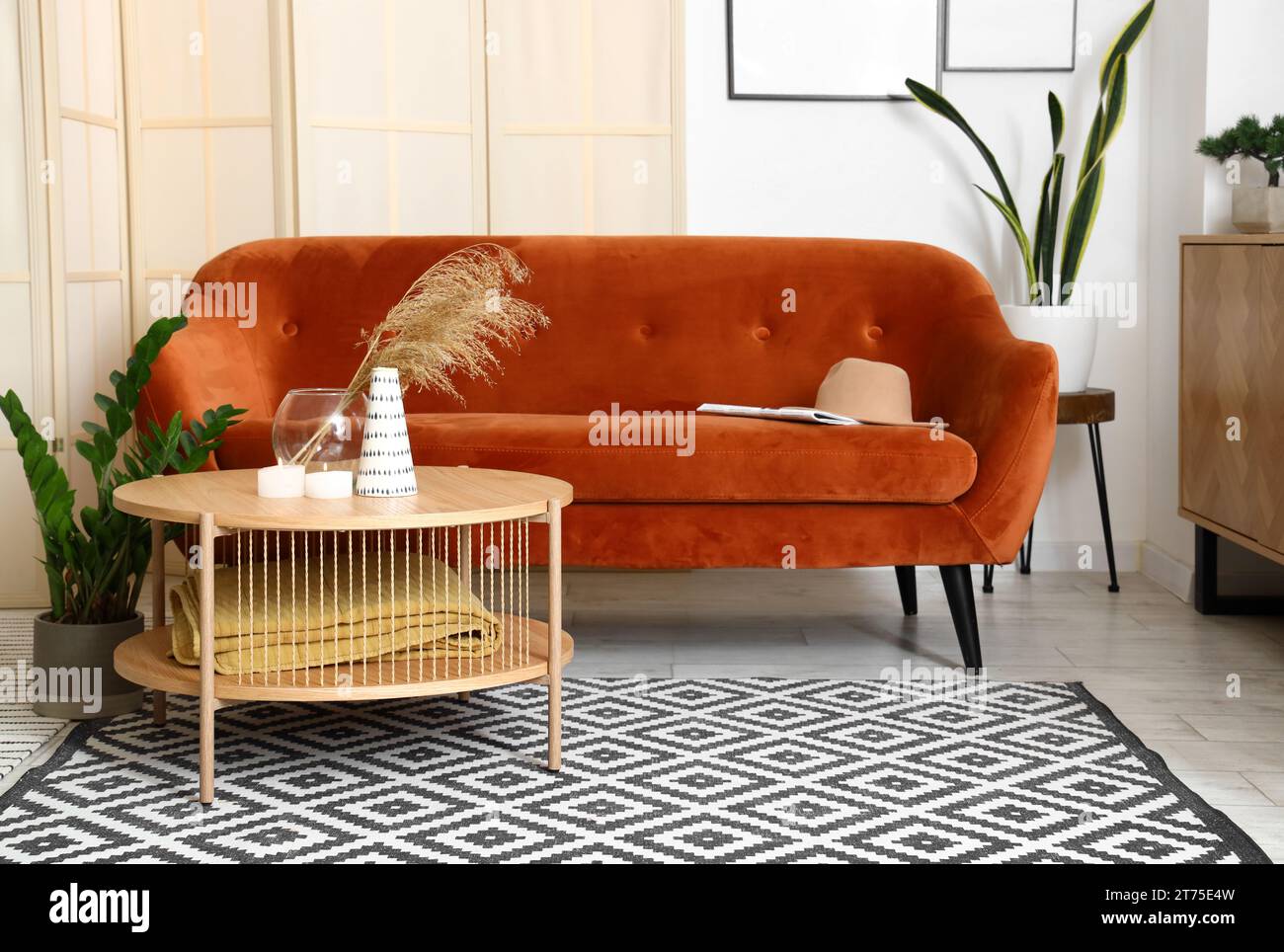 Interior of light living room with coffee table and sofa Stock Photo ...