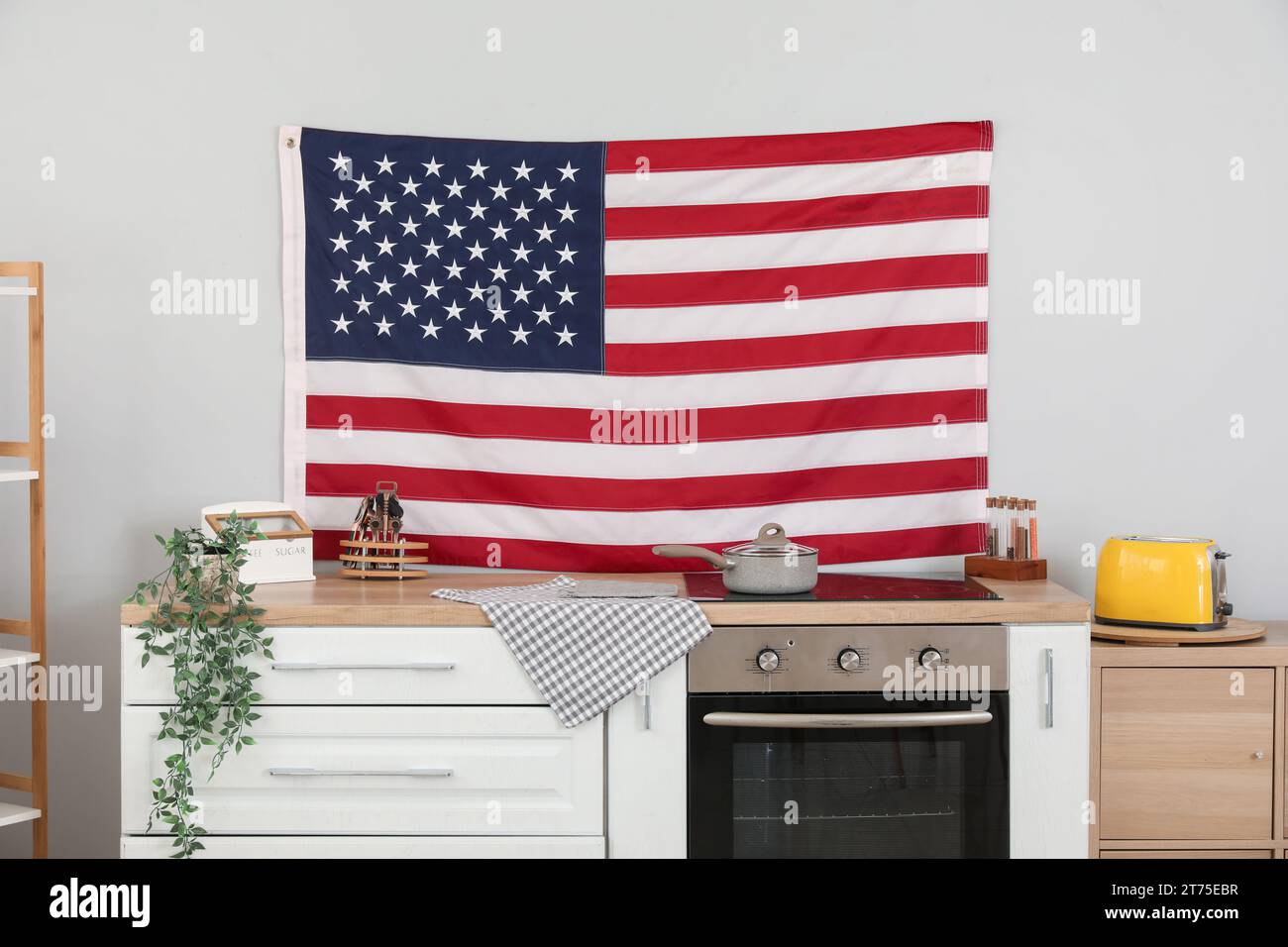 Interior of stylish kitchen with hanging USA flag Stock Photo - Alamy