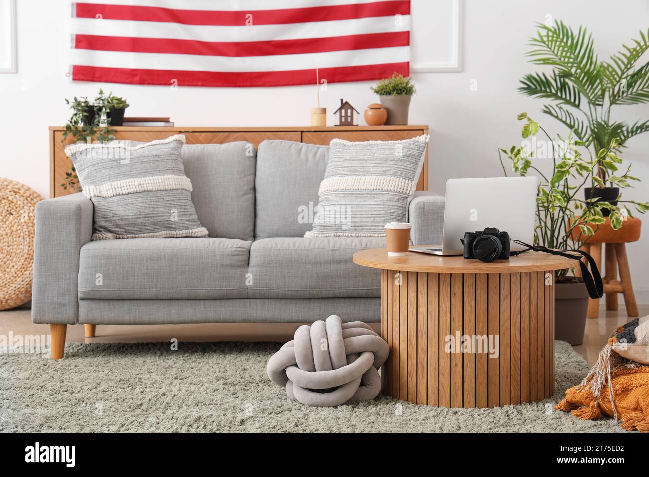 Interior of living room with USA flag, table and sofa Stock Photo - Alamy
