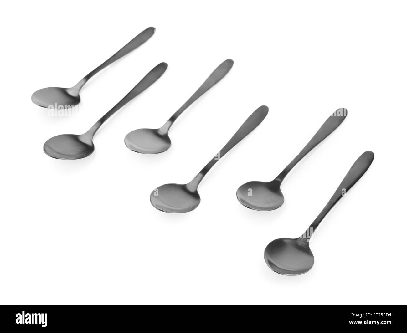Stainless steel spoons on white background Stock Photo - Alamy