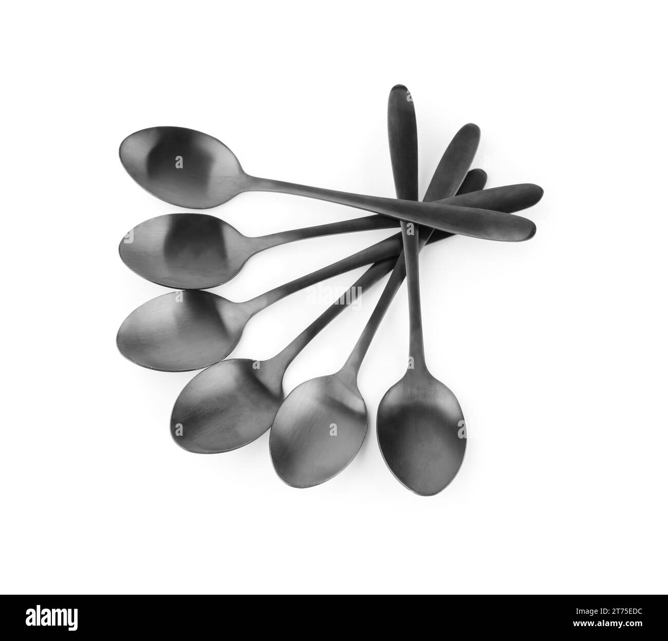 Stainless steel spoons on white background Stock Photo - Alamy