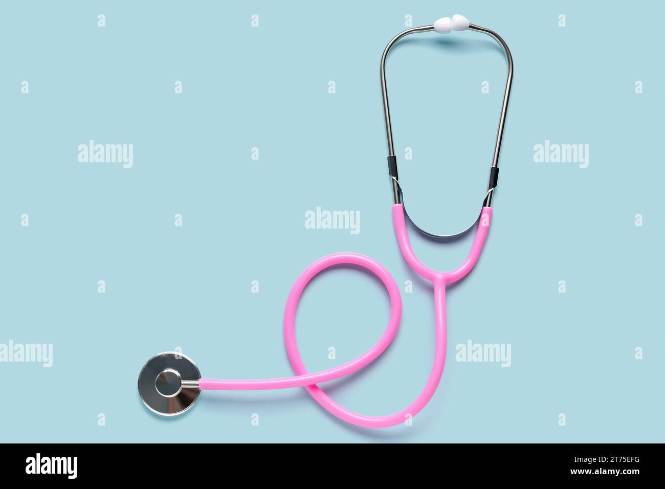 Modern stethoscope on light blue background Stock Photo - Alamy