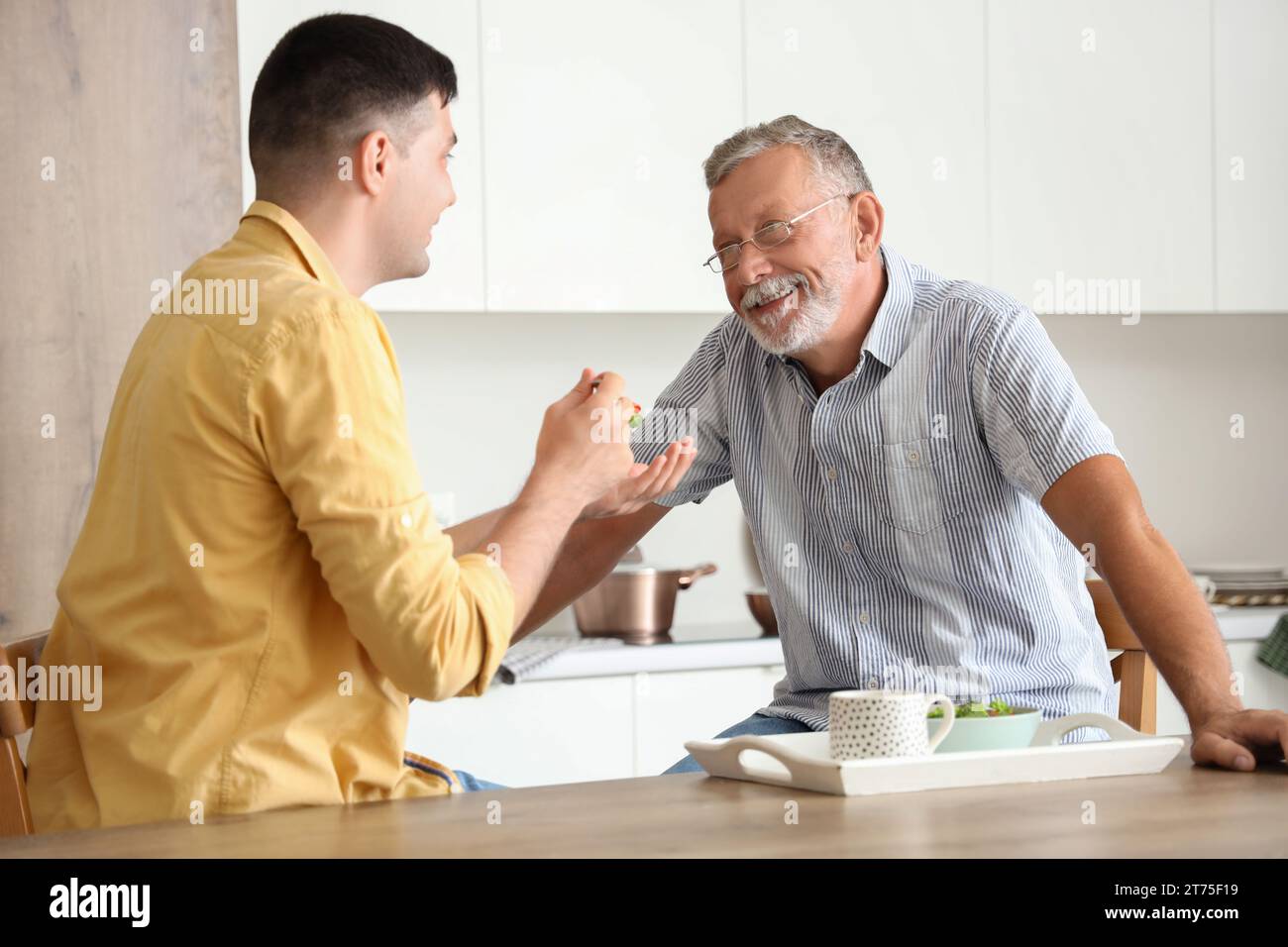 Man father comforting hi-res stock photography and images - Alamy