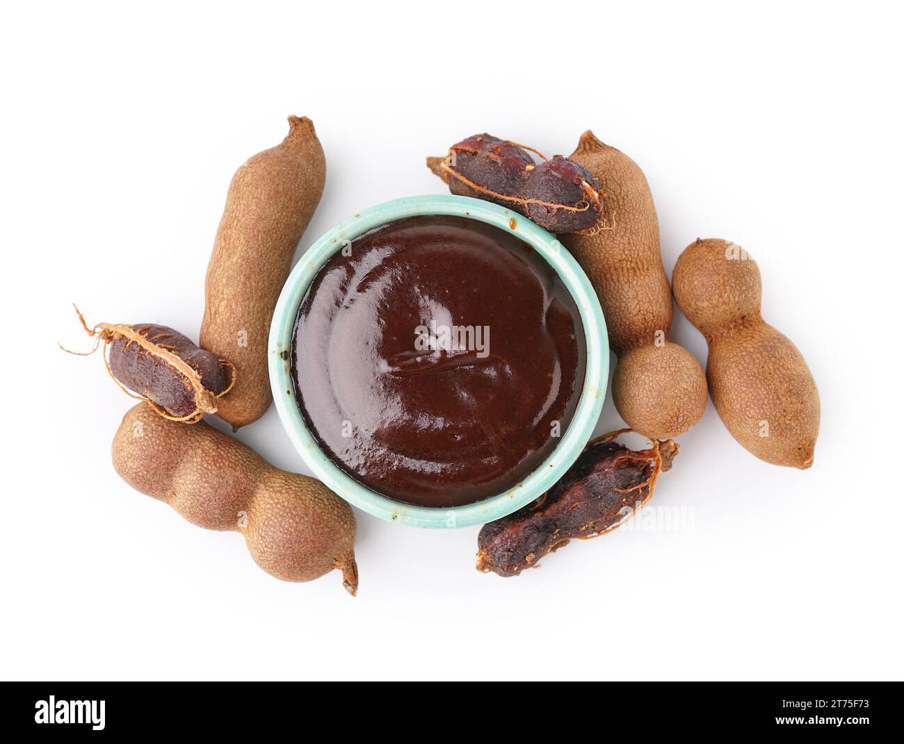 Bowl with tasty tamarind jam with fruits on white background Stock ...