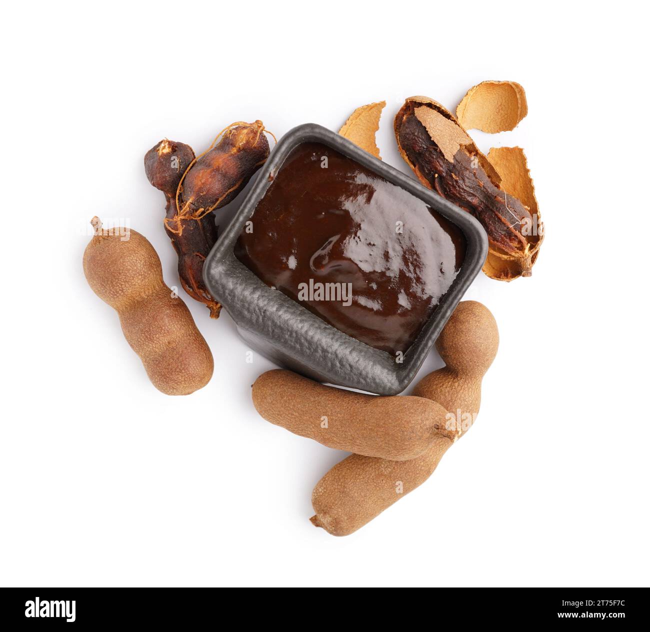 Bowl with tasty tamarind jam with fruits on white background Stock ...