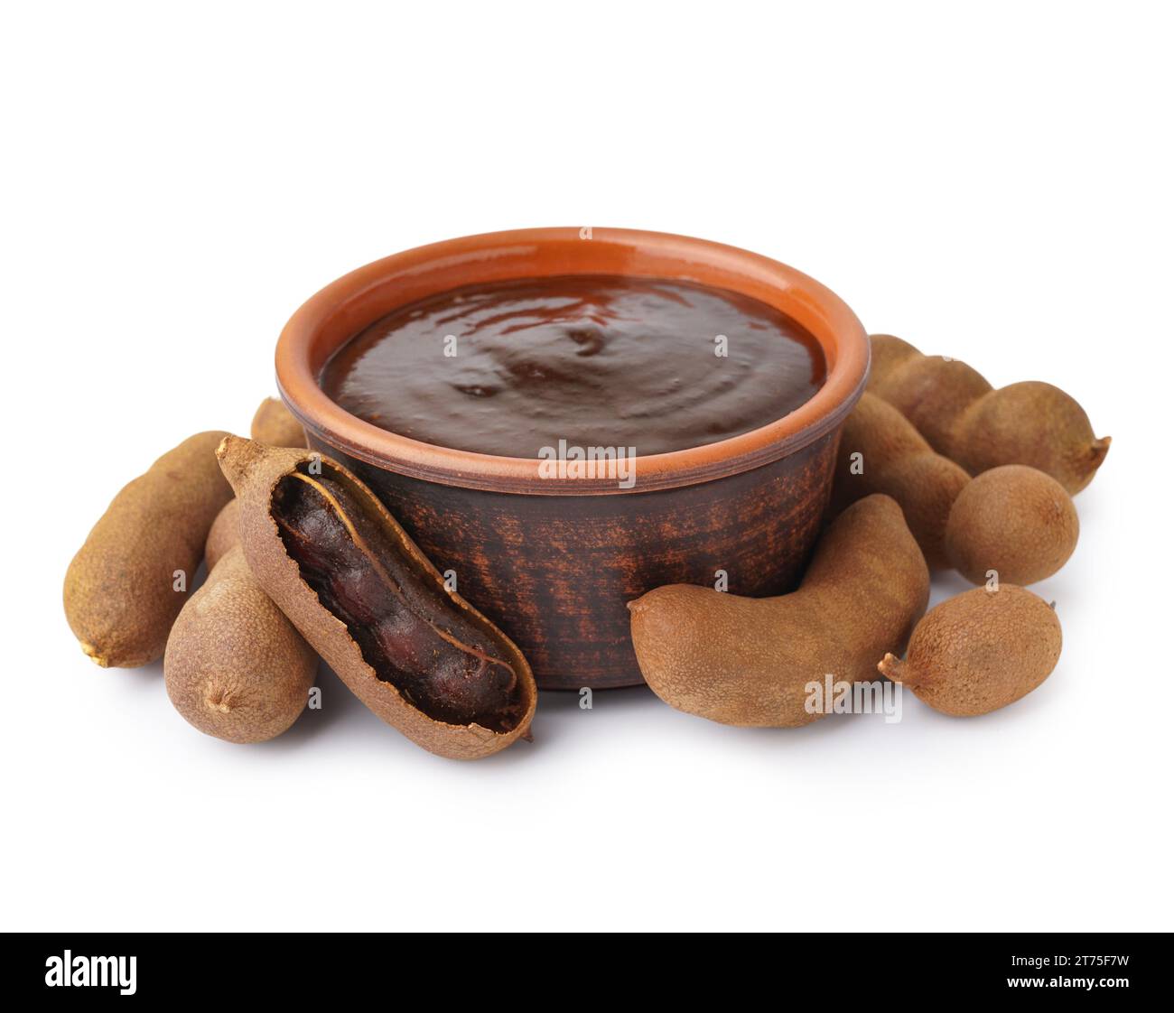 Bowl of tasty tamarind jam and fruits on white background Stock Photo ...