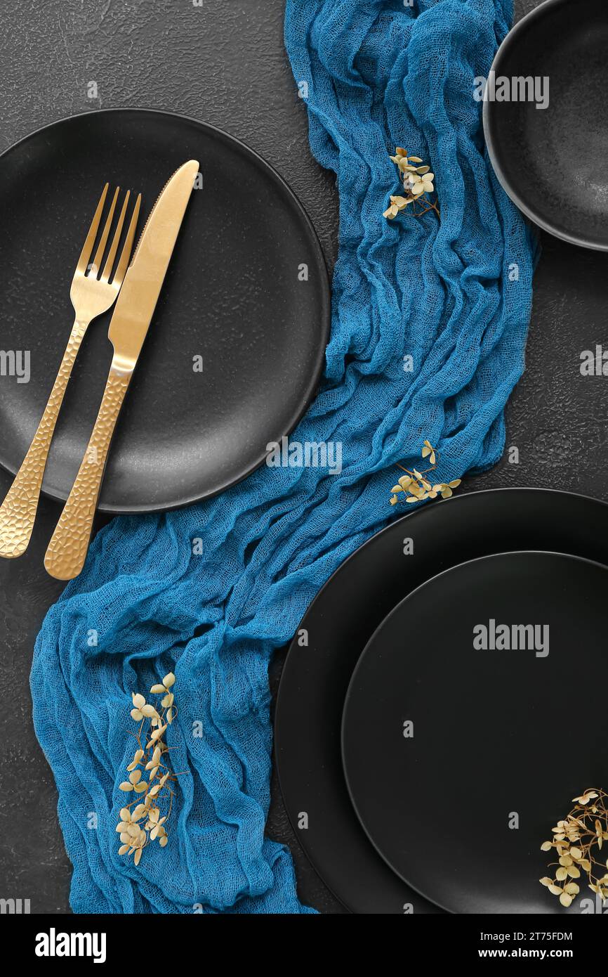 Stylish table setting on black background Stock Photo - Alamy