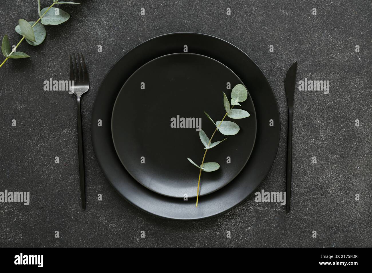 Stylish table setting on black background Stock Photo - Alamy