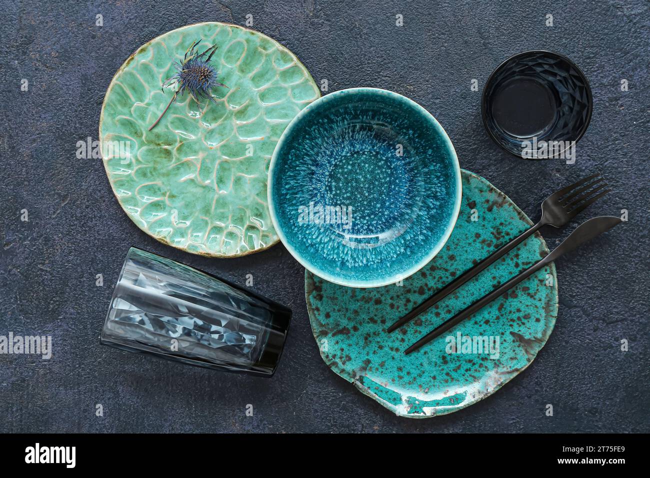 Stylish table setting on black background Stock Photo - Alamy