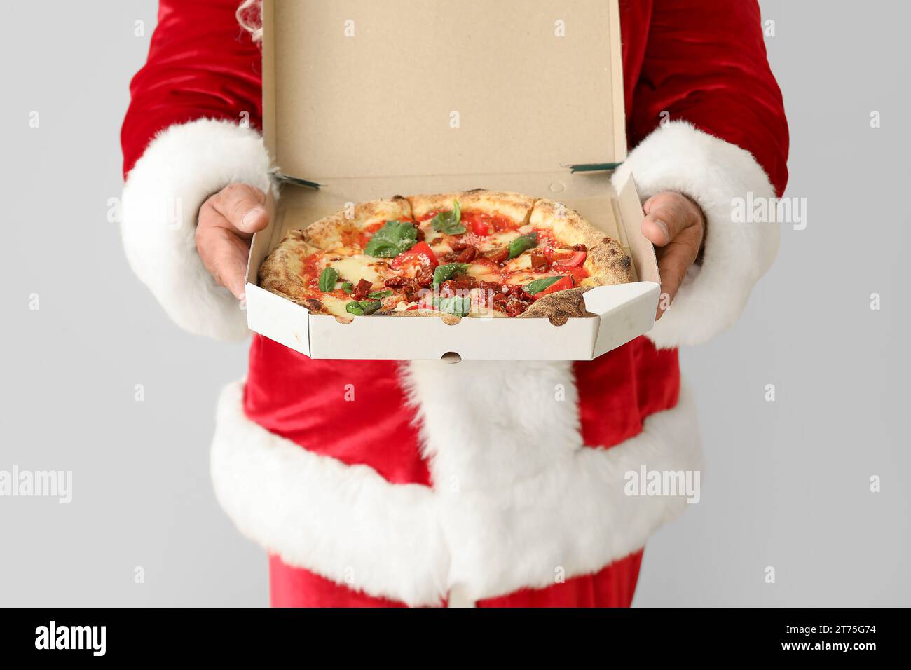 Santa Claus with box of tasty pizza on white background Stock Photo - Alamy