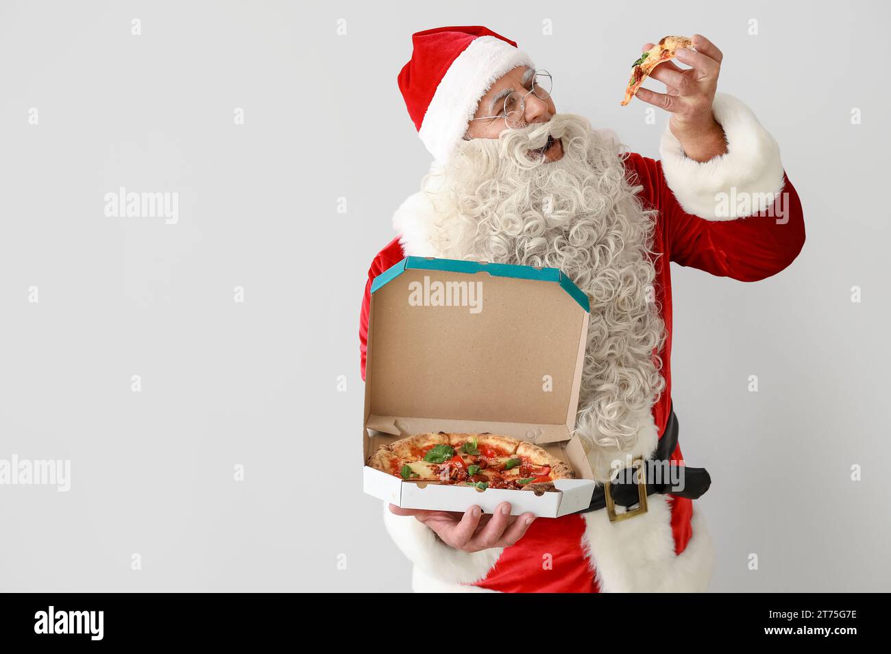 Santa eating pizza hi-res stock photography and images - Alamy