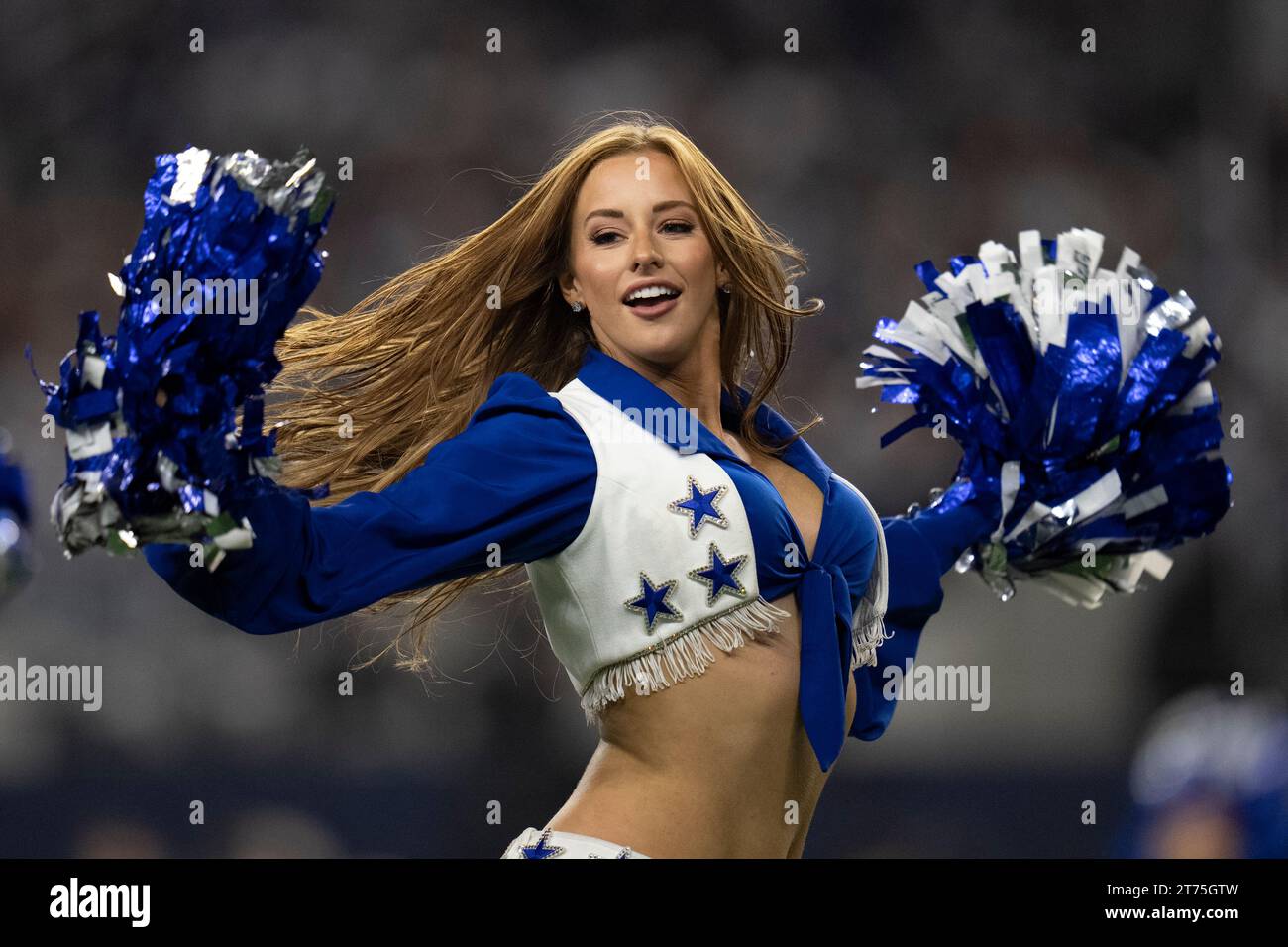 A Dallas Cowboys cheerleader performs during the second half of an NFL ...