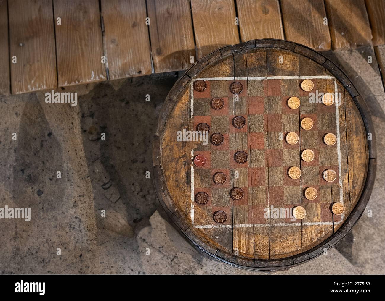 Old time cowboy checkers on the top of a whiskey barrel Stock Photo - Alamy