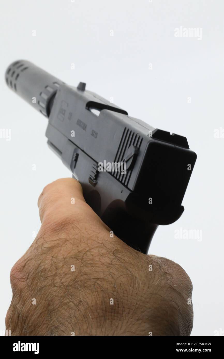 Human hand aims the pistol type firearm Stock Photo - Alamy