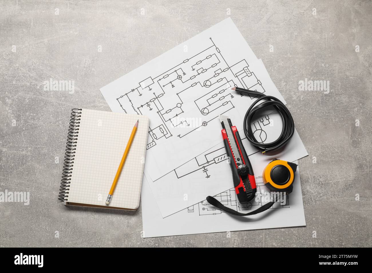 Wiring diagrams, wires and tools on grey table, flat lay Stock Photo ...