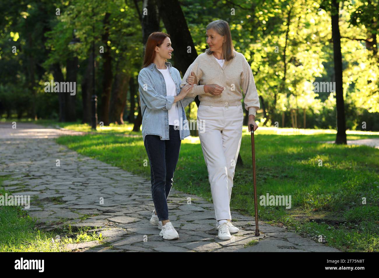 Lady with cane hi-res stock photography and images - Alamy
