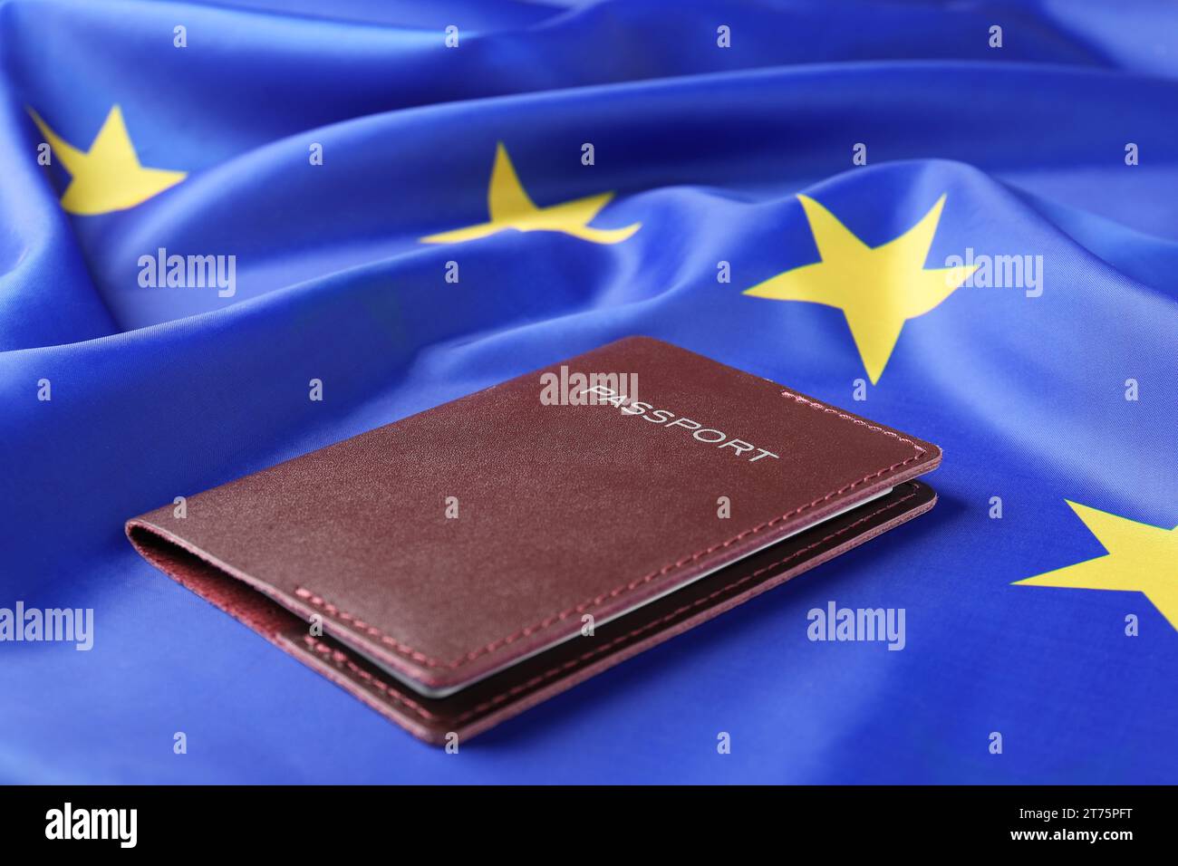 Immigration to Europe. Passport on flag, closeup Stock Photo - Alamy