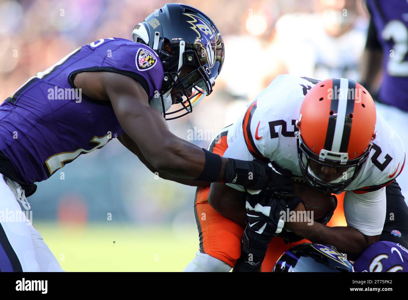 Baltimore Ravens cornerback Brandon Stephens (21) tries to strip the ...