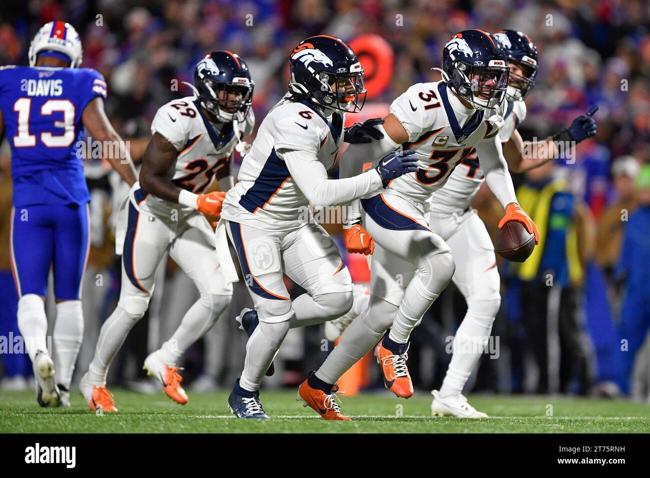 Denver Broncos' Justin Simmons (31), right, reacts after interception ...