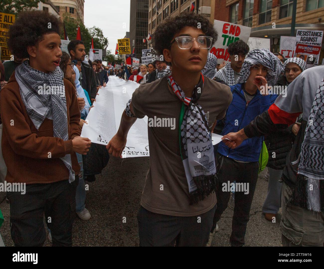 Austin, Texas, USA. 12th Nov, 2023. Protestors carry an unfurled list ...
