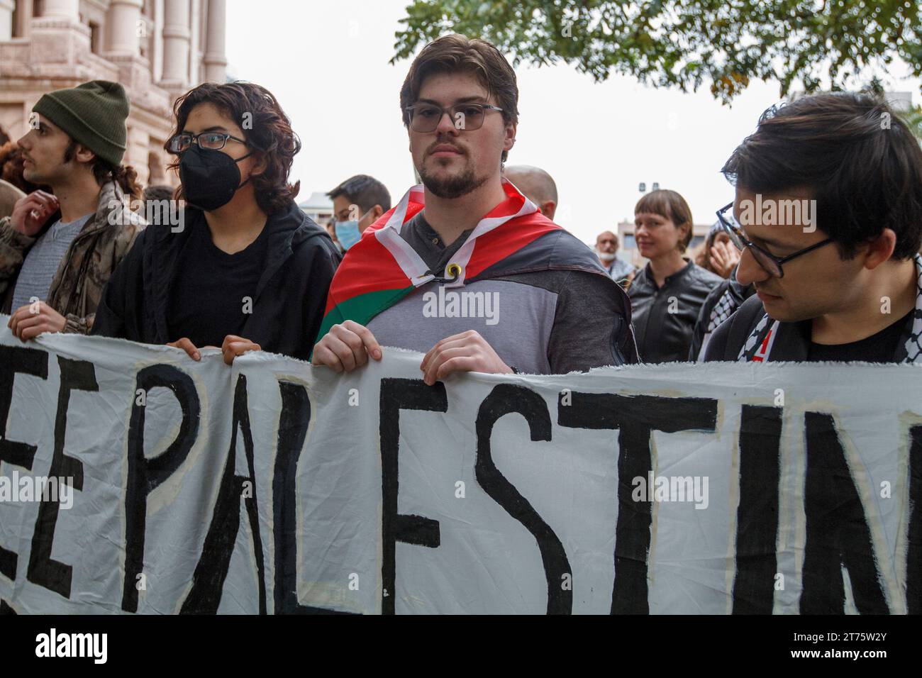 Austin, Texas, USA. 12th Nov, 2023. A group of young men hold a sign in ...