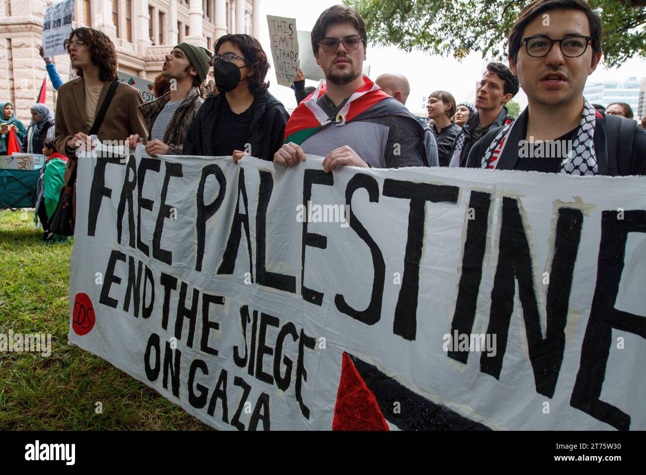 Austin, Texas, USA. 12th Nov, 2023. A group of young men hold a sign in ...