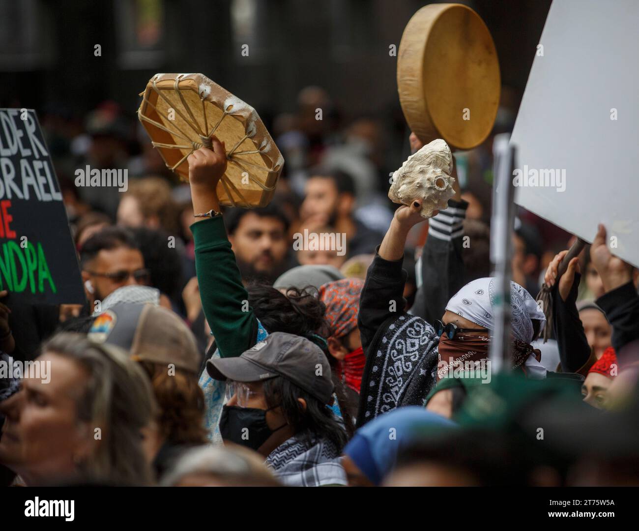 Austin, Texas, USA. 13th Nov, 2023. A woman holds up a replica of a ...