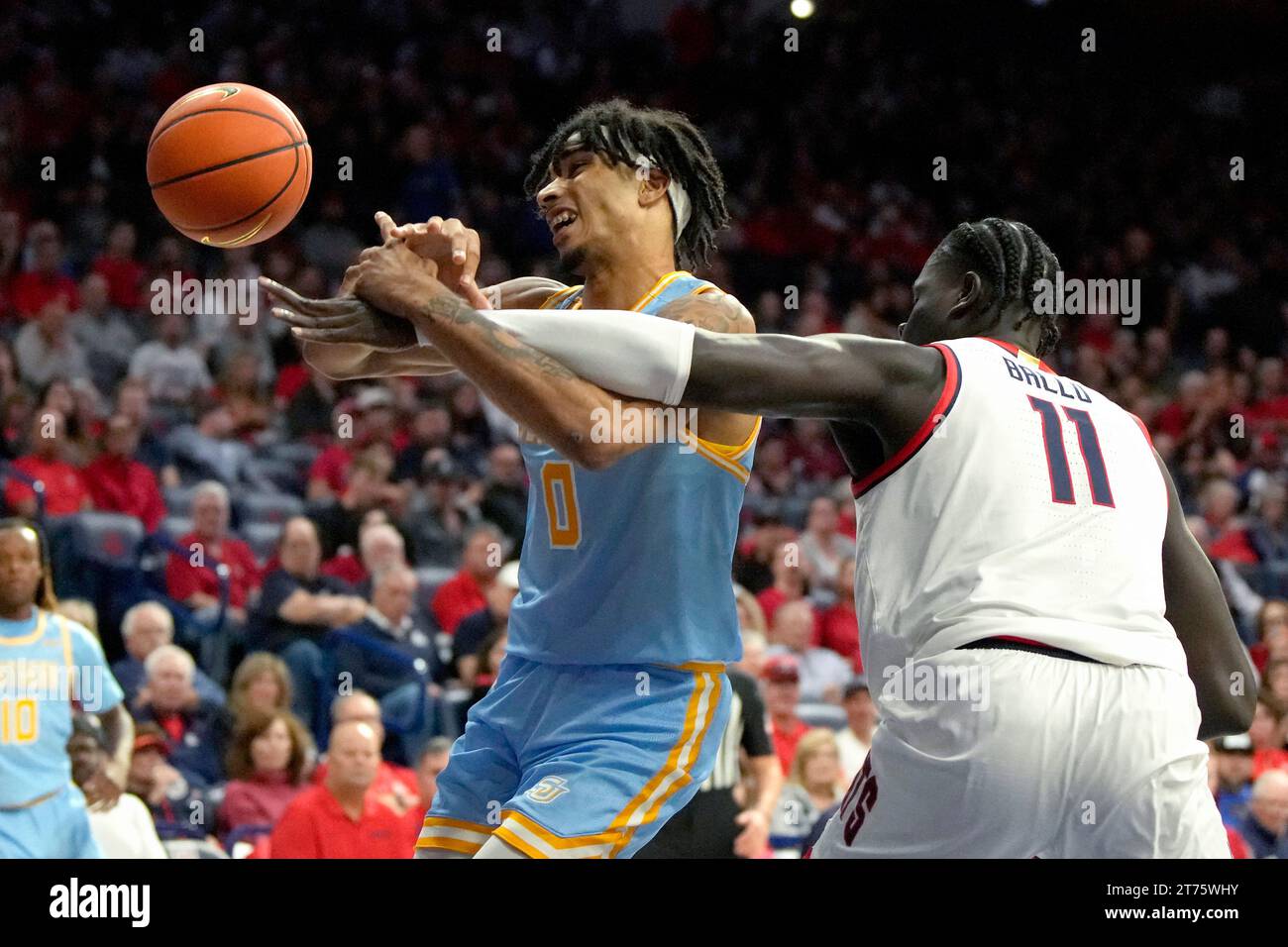 Arizona center Oumar Ballo (11) fouls Southern University forward ...