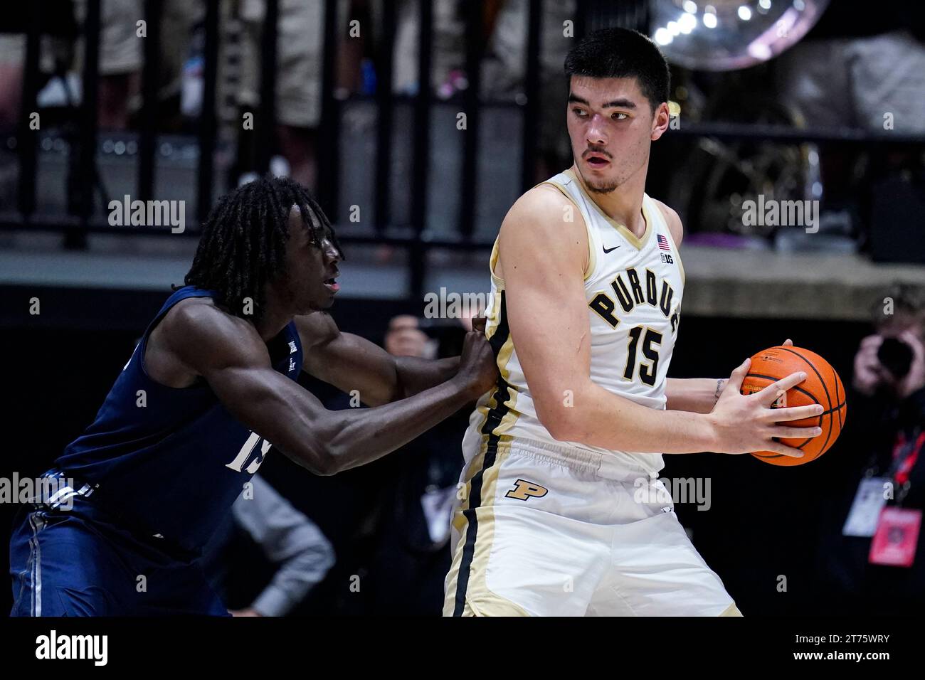 Xavier center Kachi Nzeh (15) defends Purdue center Zach Edey (15 ...