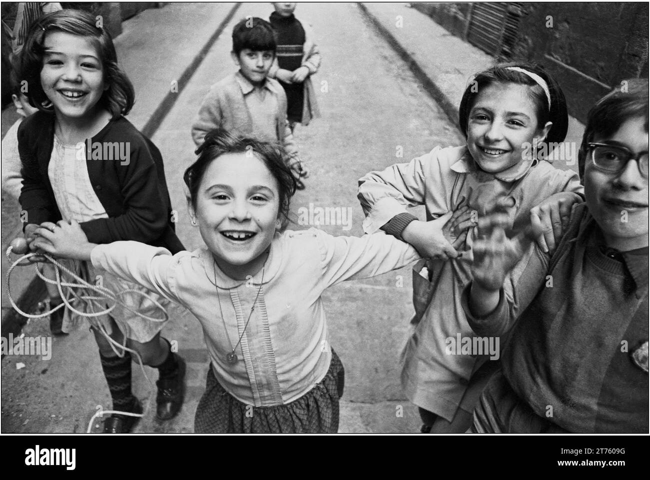 Children playing in the street and competing for attention, Las Ramblas ...