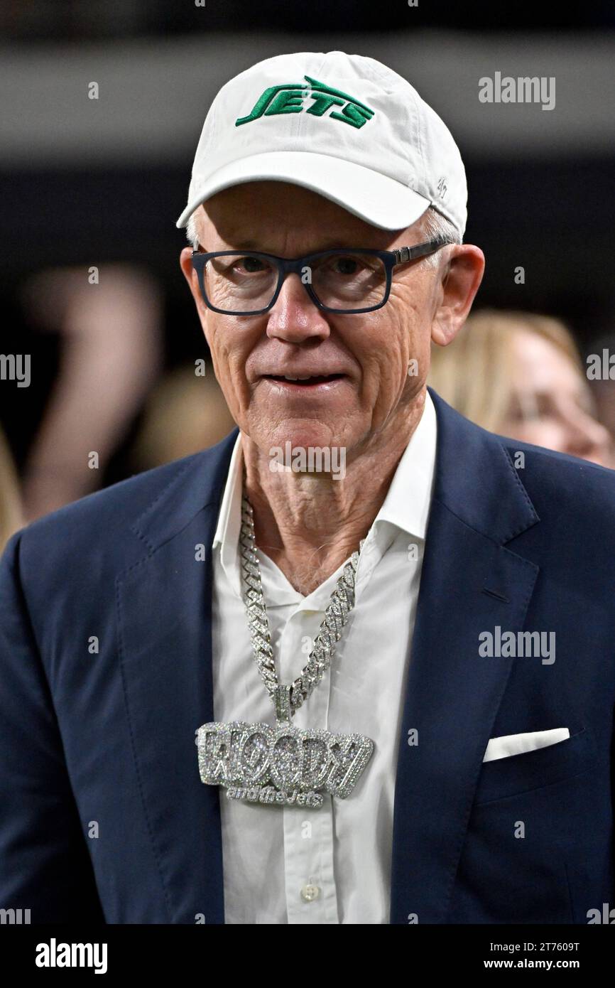 New York Jets owner Woody Johnson walks on the field before the start of an NFL football game ...