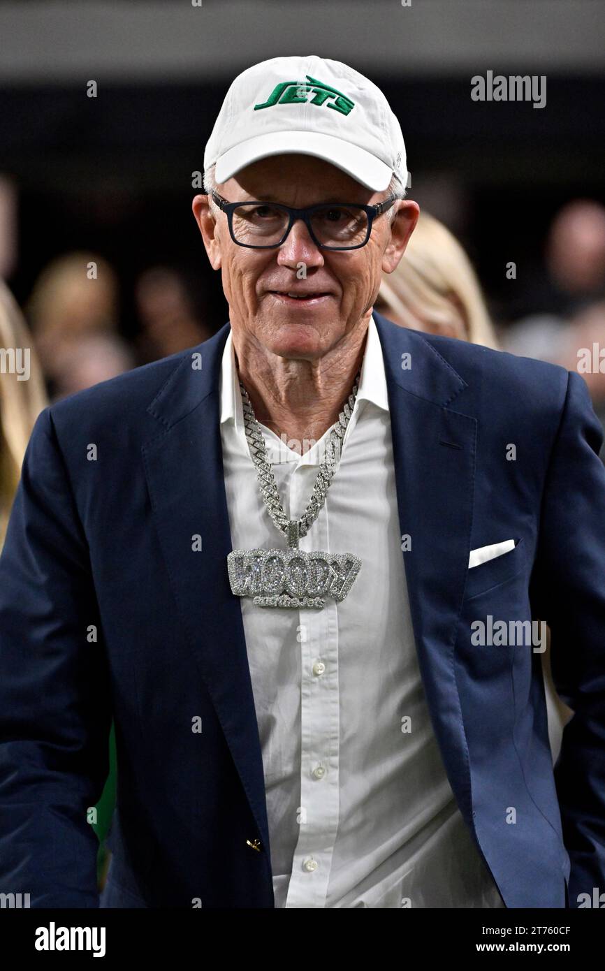 New York Jets owner Woody Johnson walks on the field before the start of an NFL football game ...