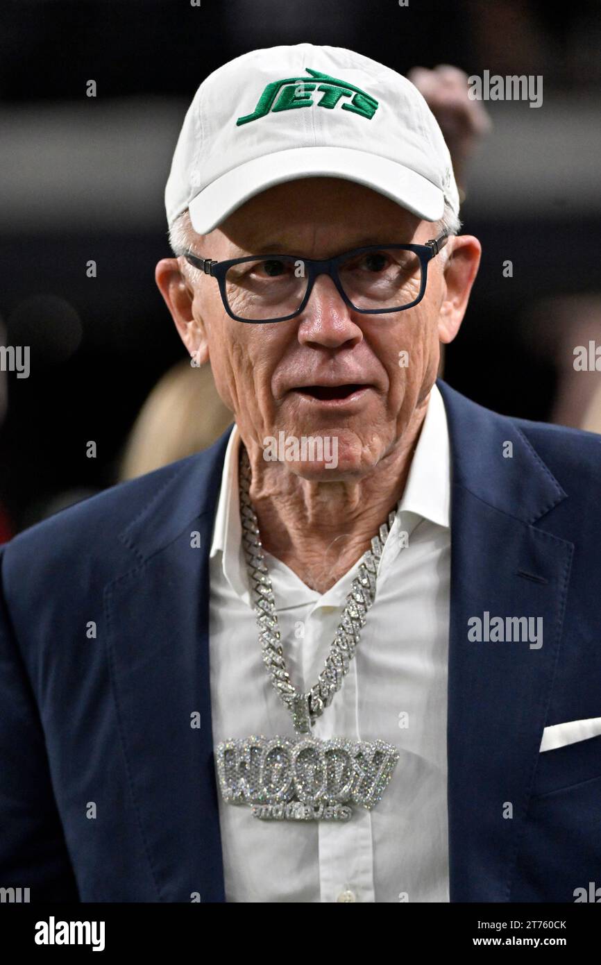 New York Jets owner Woody Johnson walks on the field before the start of an NFL football game ...