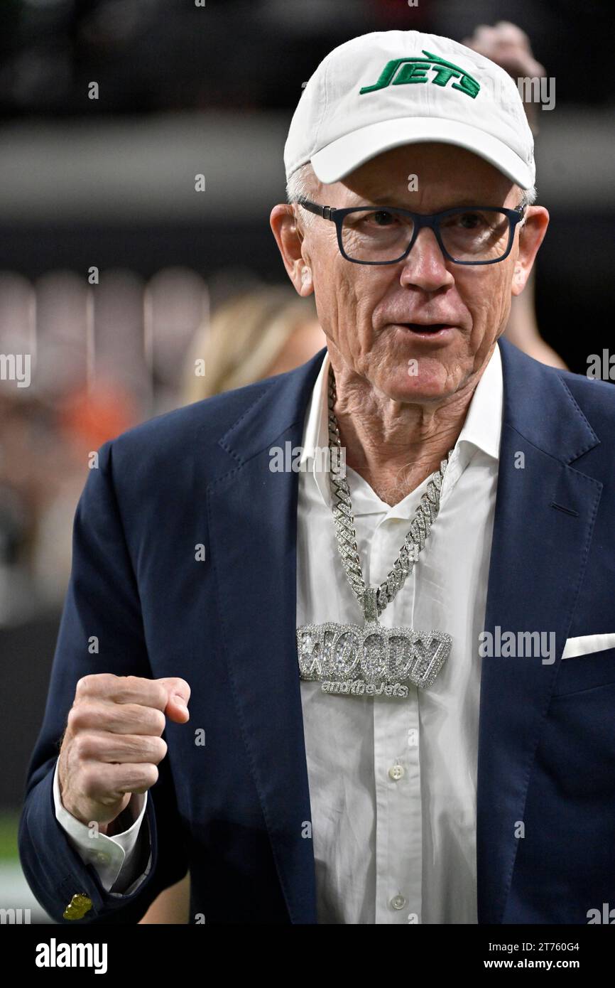 New York Jets owner Woody Johnson walks on the field before the start ...